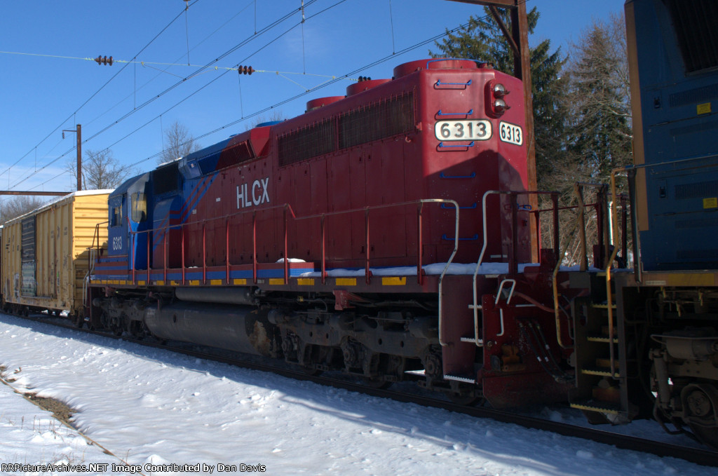 HLCX SD40-2 6313 trails on Q409-05